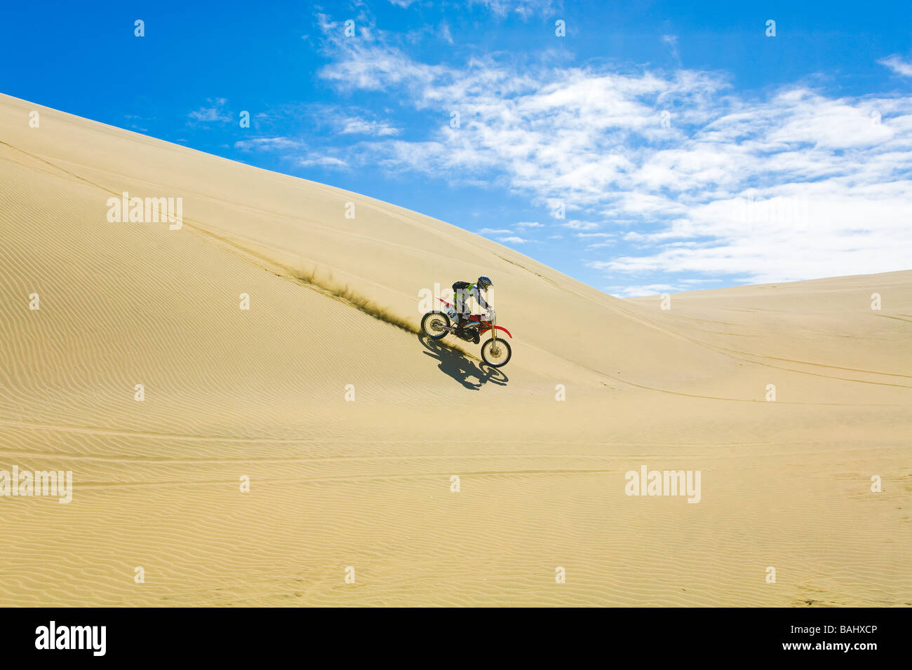 motorcyclist in sand dunes Stock Photo - Alamy