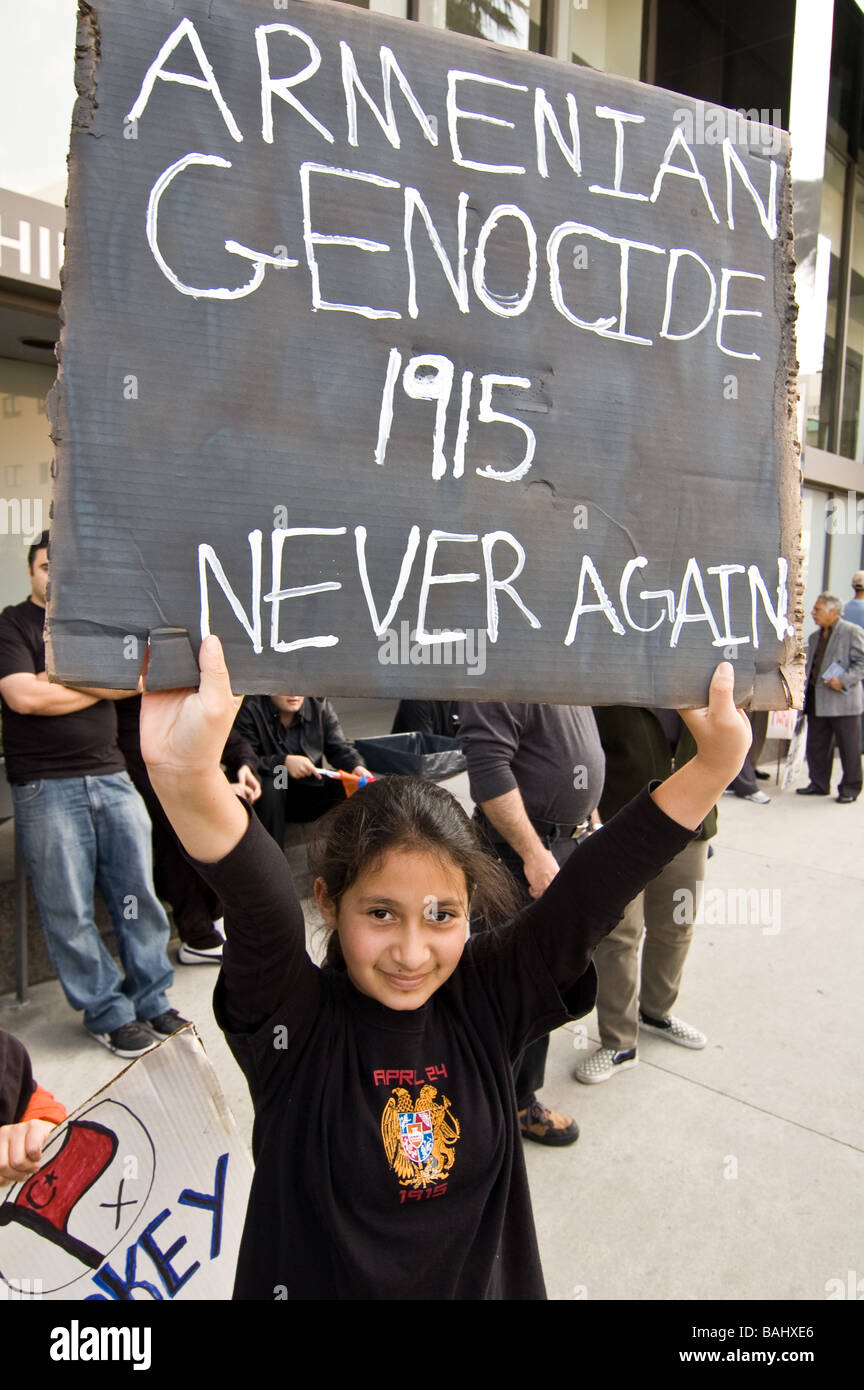 A young Armenian girl holds up a sign "Armenian Genocide 1915 Never ...