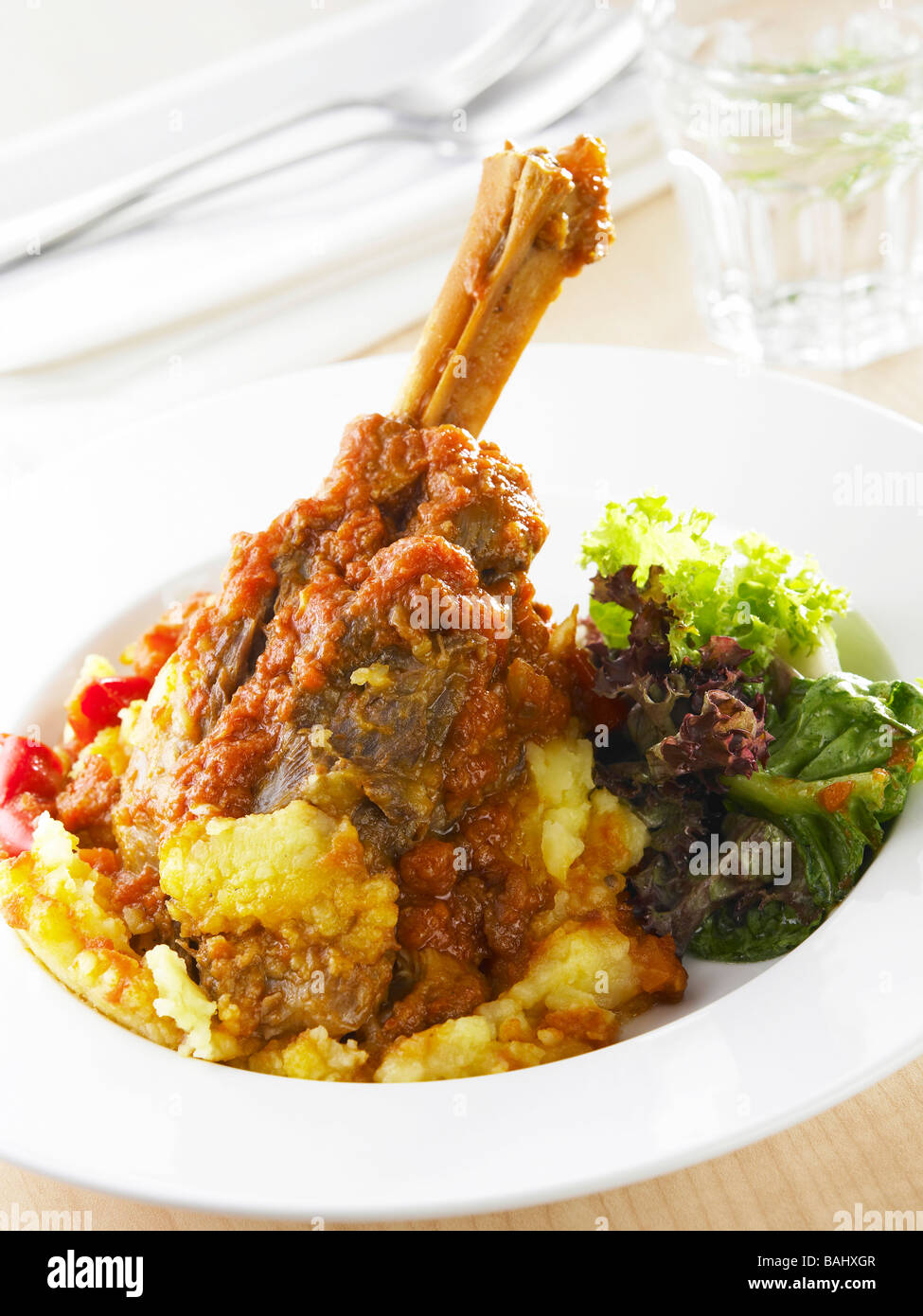 main course of lamb shank ready to eat Stock Photo - Alamy
