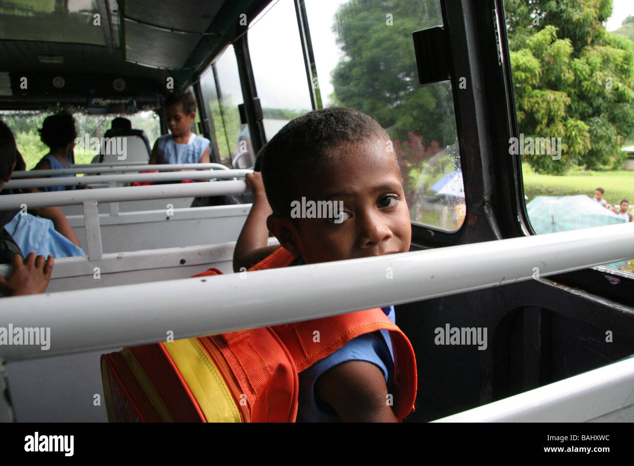 Fijian child on school bus Stock Photo - Alamy