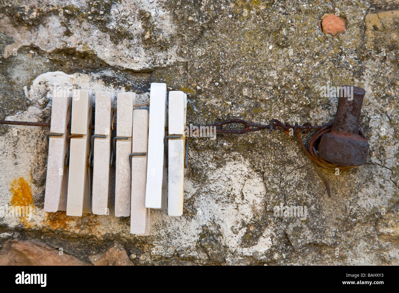 Detail of pegs on a rusting wire washing line at San Gimignano, Tuscany ...