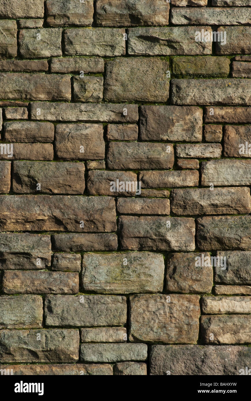 A wall made of natural stone bricks Stock Photo - Alamy