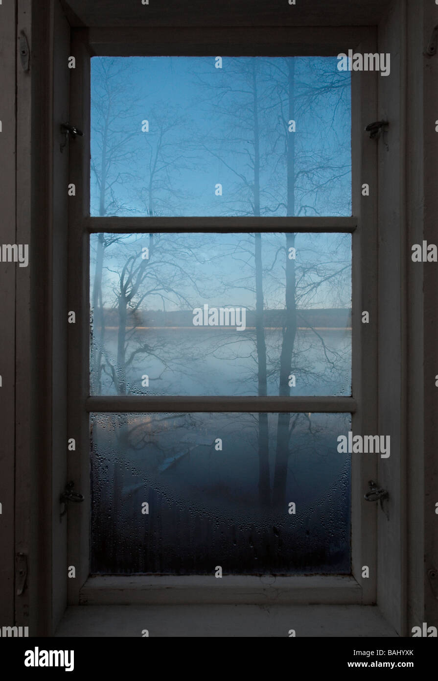 Old window frame with view towards a lake Stock Photo - Alamy