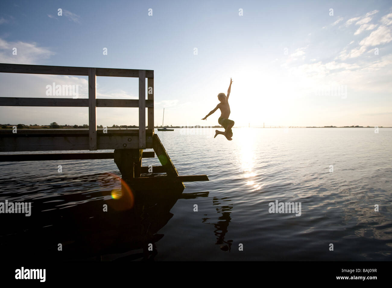 Boy diving off pier in hi-res stock photography and images - Alamy