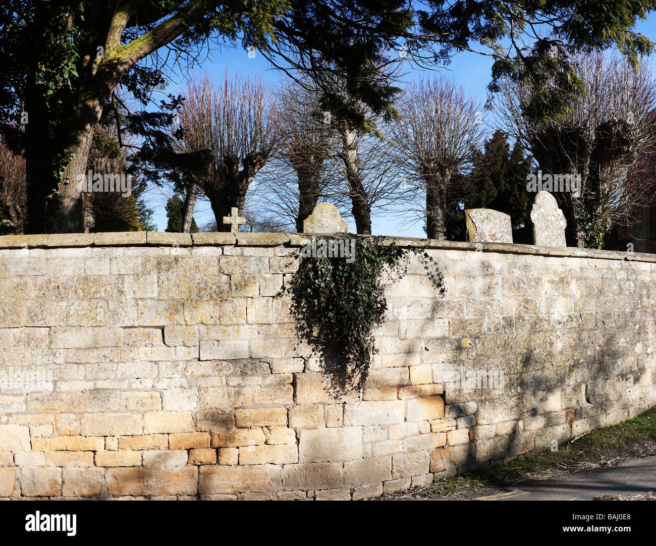 gravestones lit by the sun in a country cemetery Stock Photo - Alamy