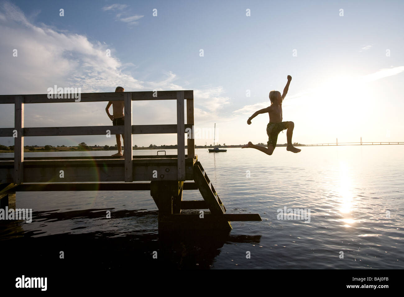 Boy diving off pier in hi-res stock photography and images - Alamy