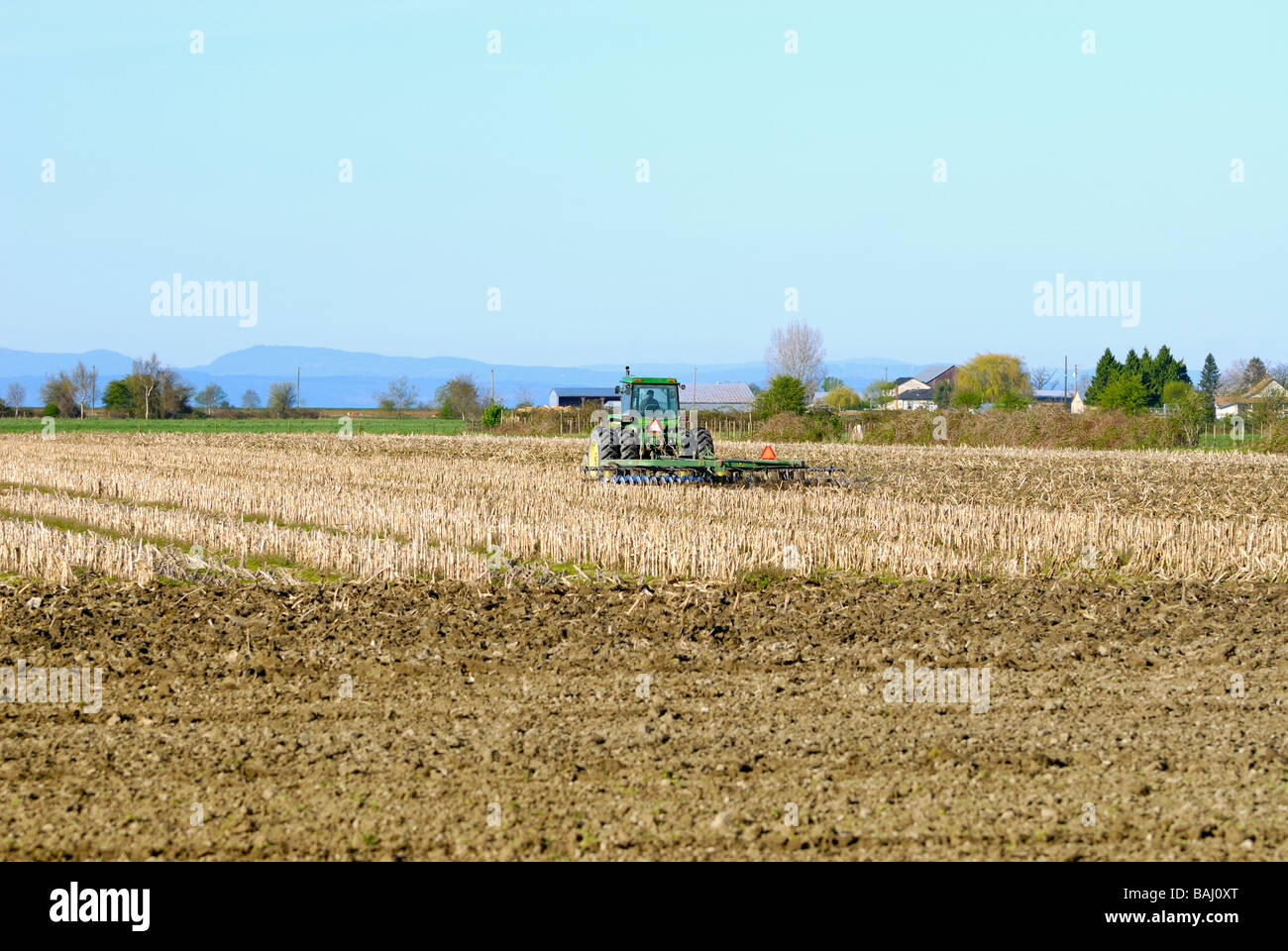 Farmer Disk Ripping a field, preparing it for planting Stock Photo - Alamy