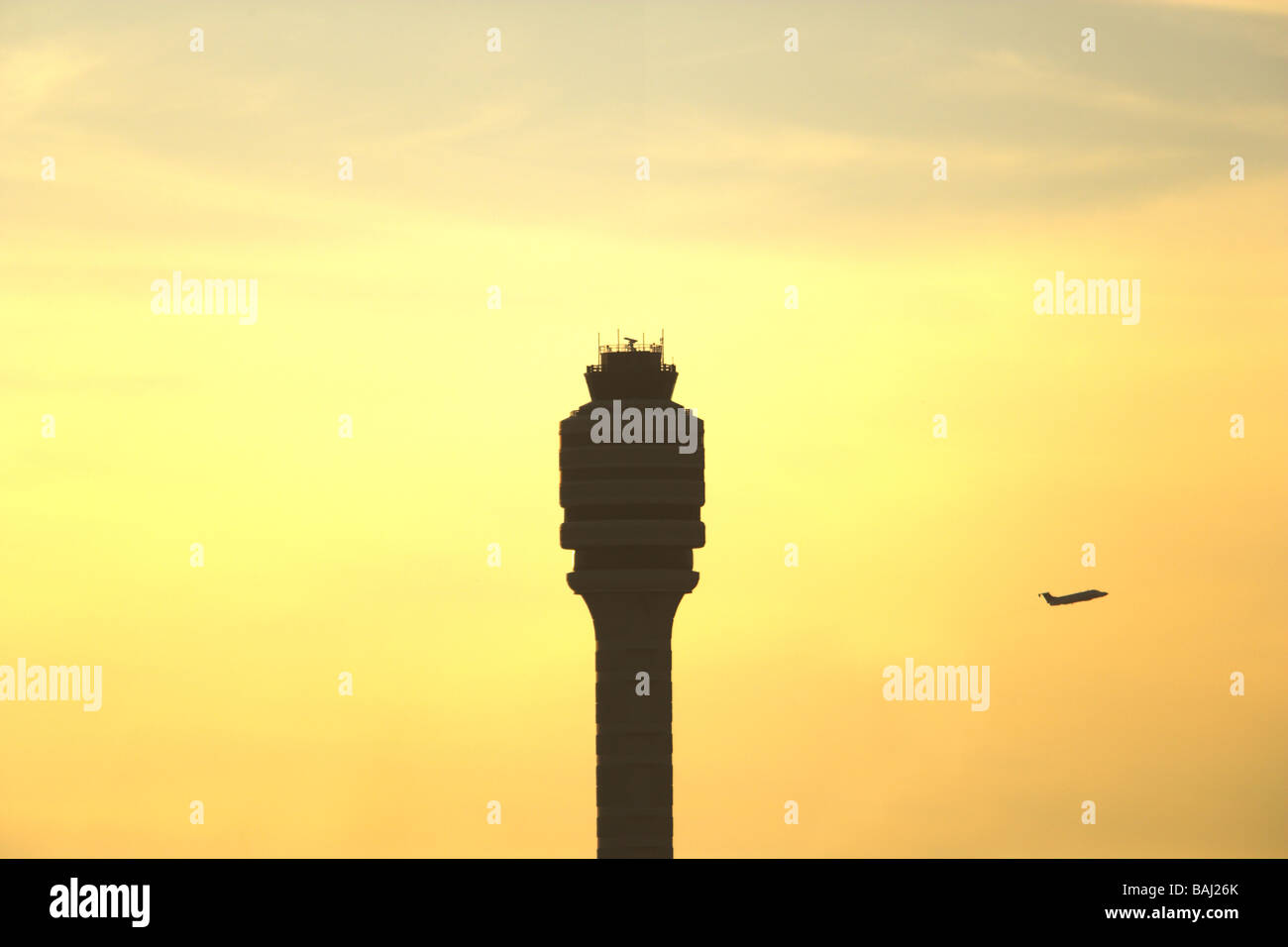 Airport control tower with airplanes taking off Stock Photo - Alamy