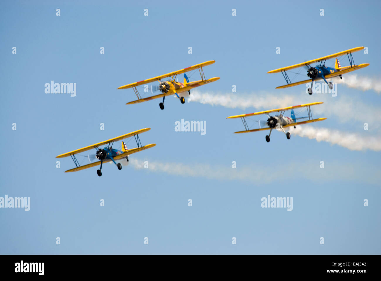 A group of 4 Stearman Biplanes in Flight formation Stock Photo - Alamy