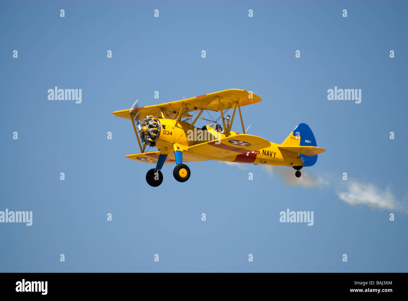 A US Navy version of the Stearman biplane trainer - in flight and seen ...