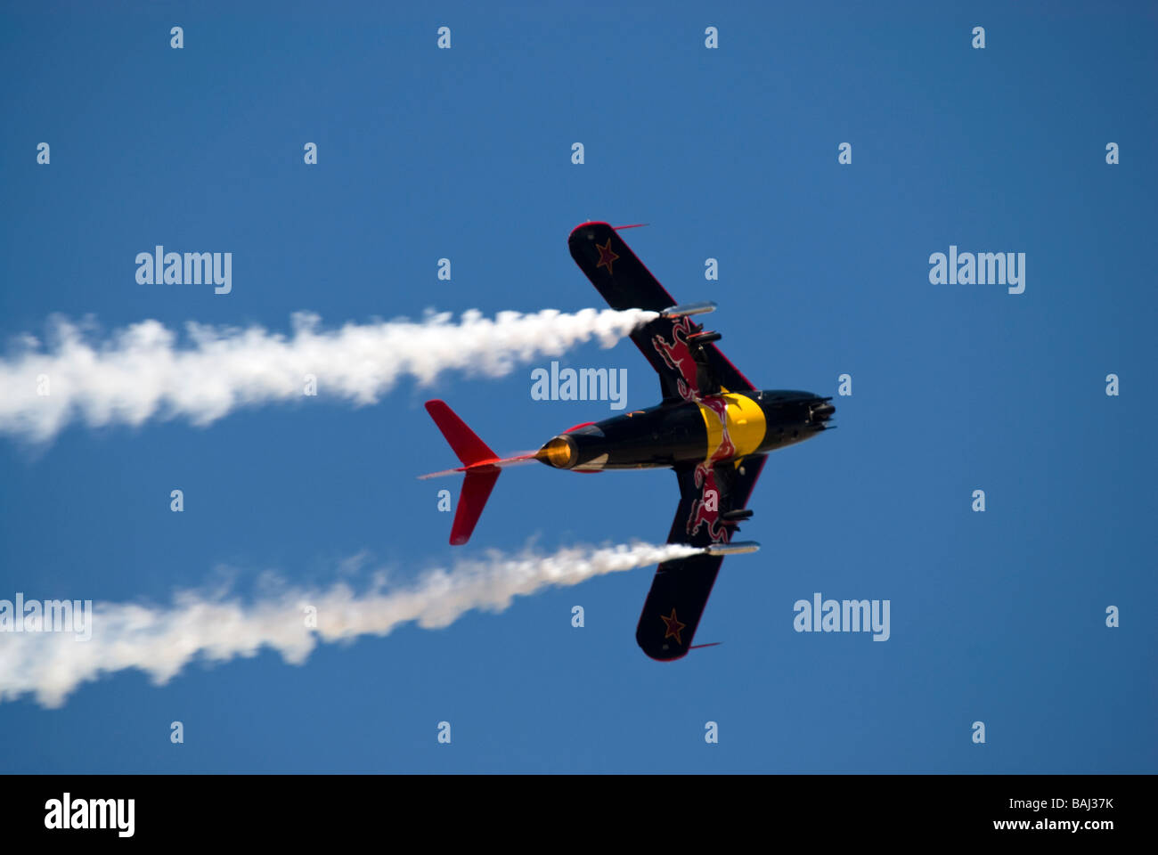 The "Red Bull" MiG-17 flies past at an airshow Stock Photo - Alamy