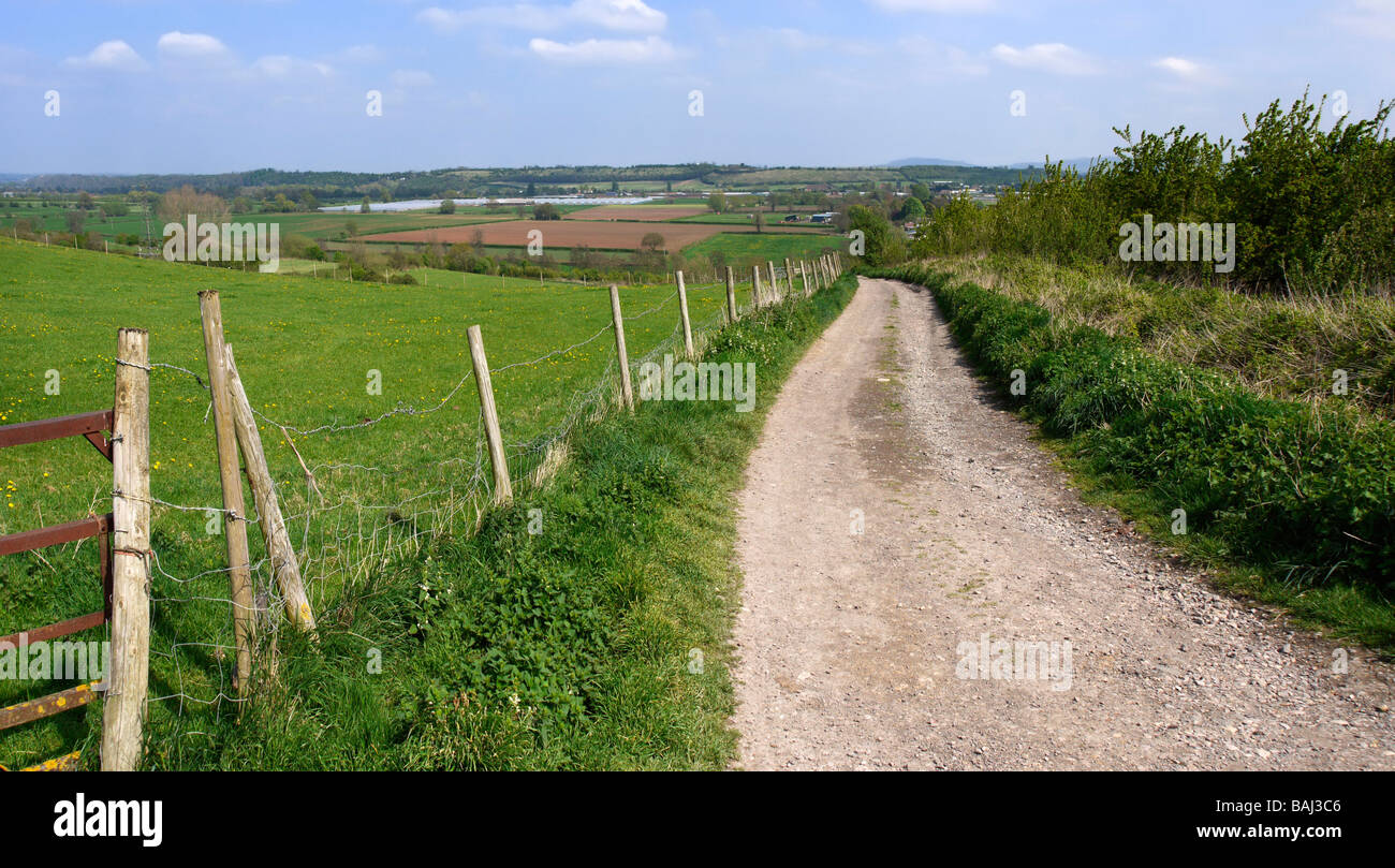 footpath on hill towards valley in distance Stock Photo - Alamy