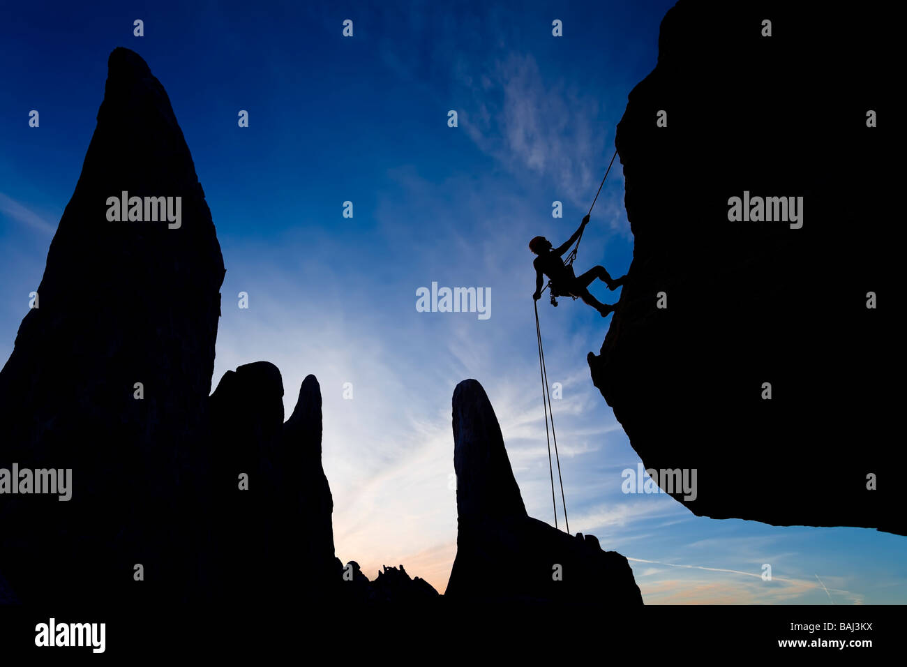 Silhouette rappelling from cliff hi-res stock photography and images ...