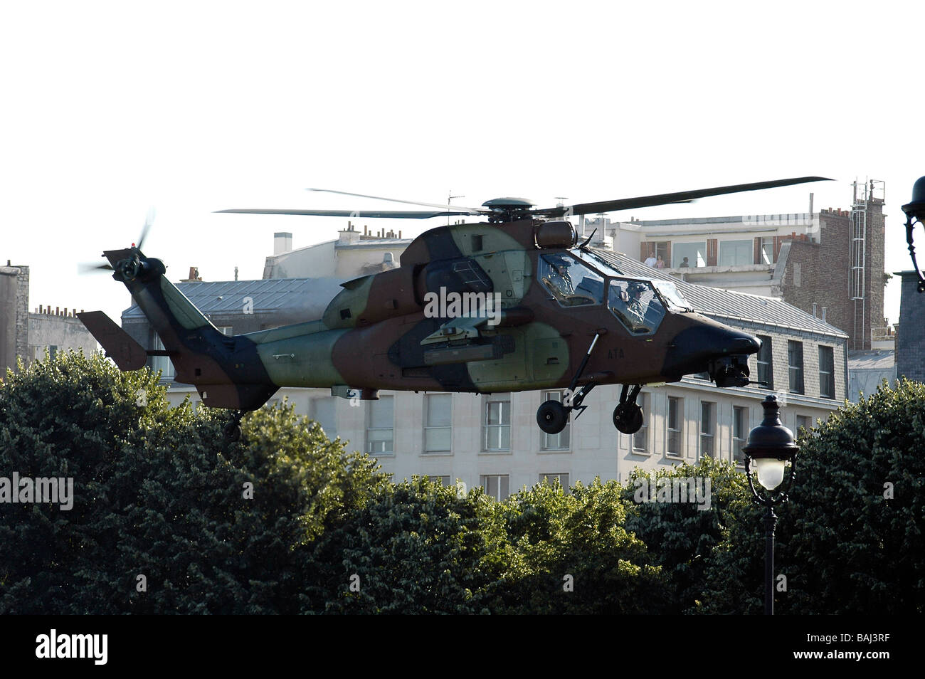 French military helicopters flying in the sky above Paris, France Stock ...