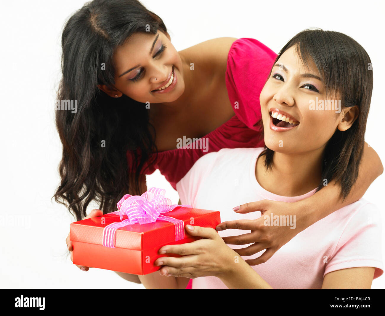 surprise look when received present from best friend Stock Photo - Alamy