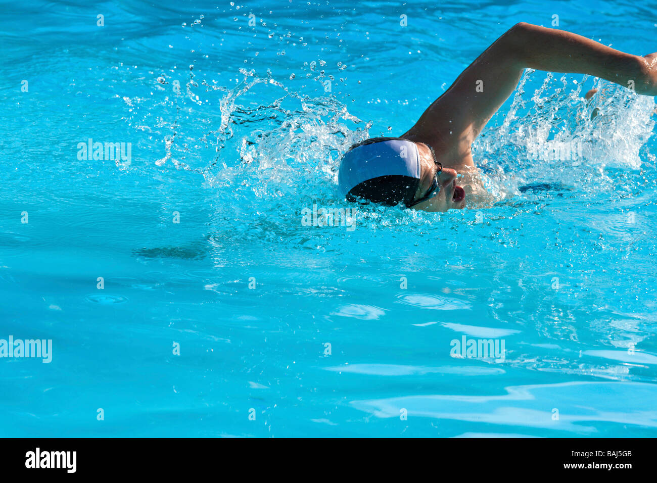 Athletic man swimming in the pool Stock Photo - Alamy