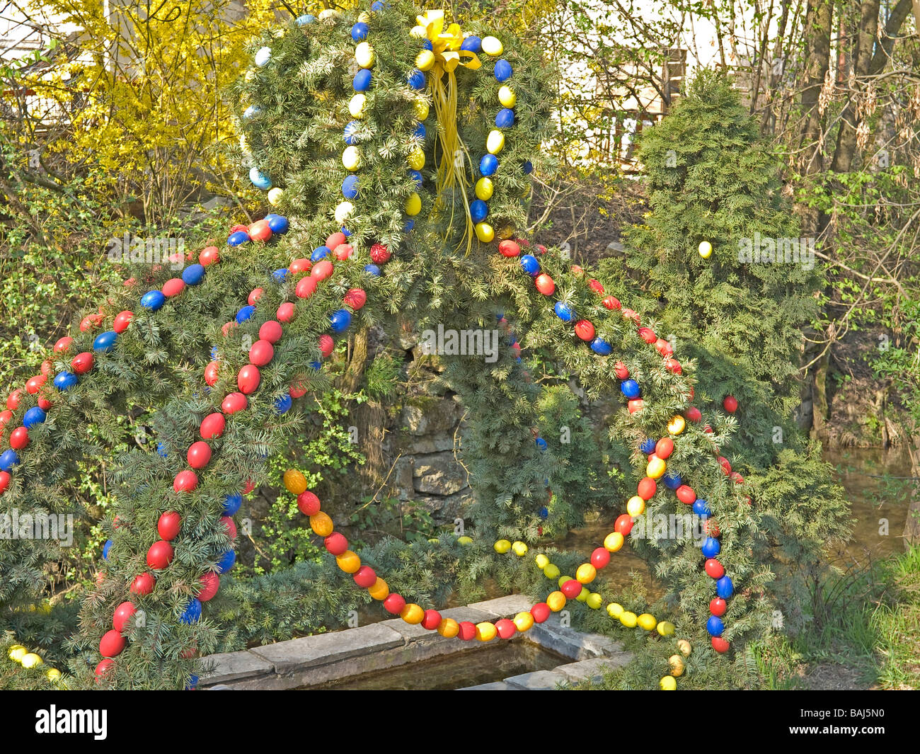 Easter well easter eggs at decoration over a little water tank in ...