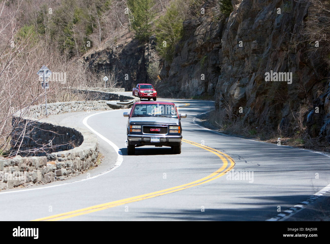 Cars and trucks on a winding road in New York USA Stock Photo - Alamy