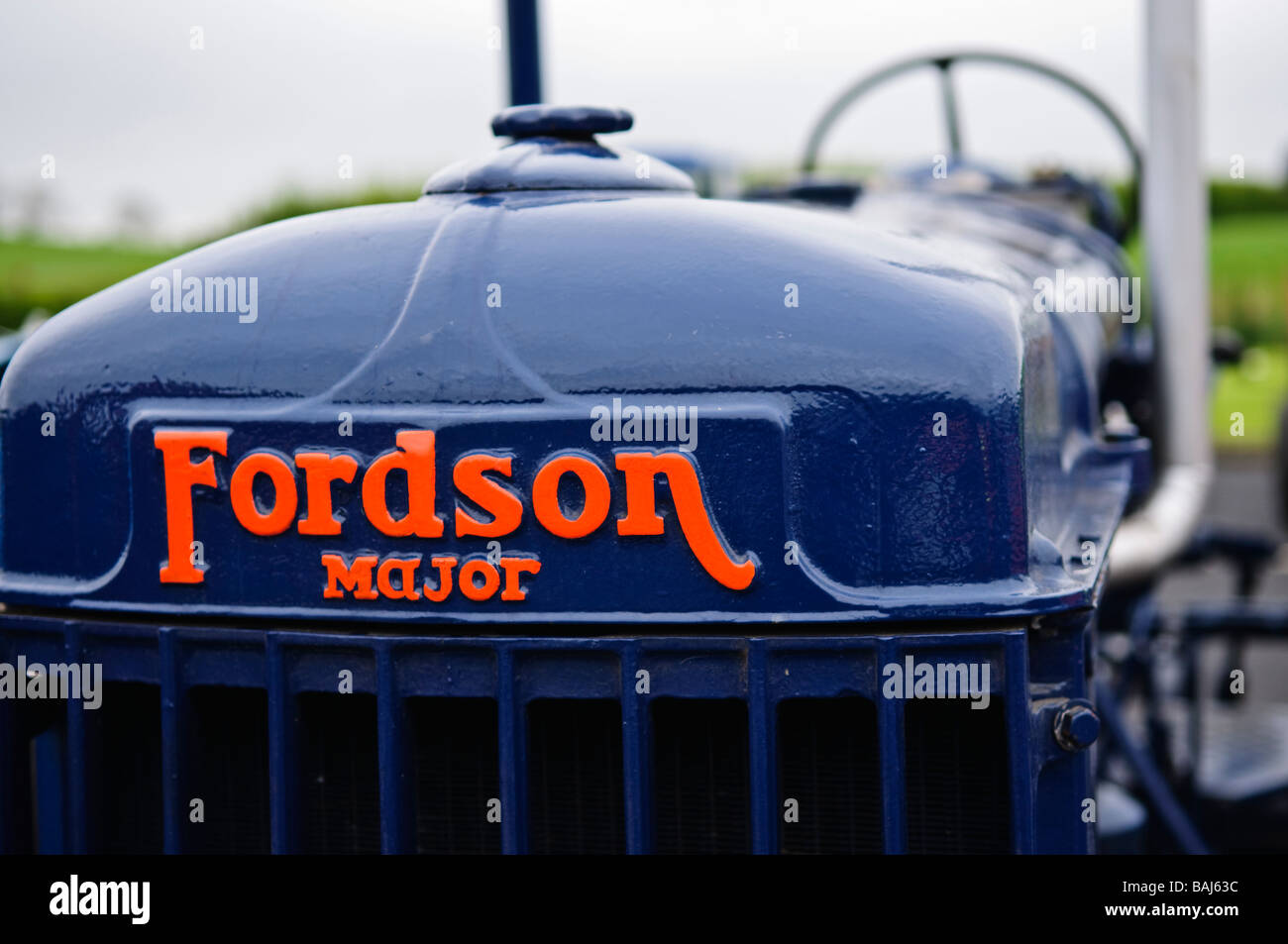 Front grille and badge of a blue vintage Fordson Major farm tractor ...
