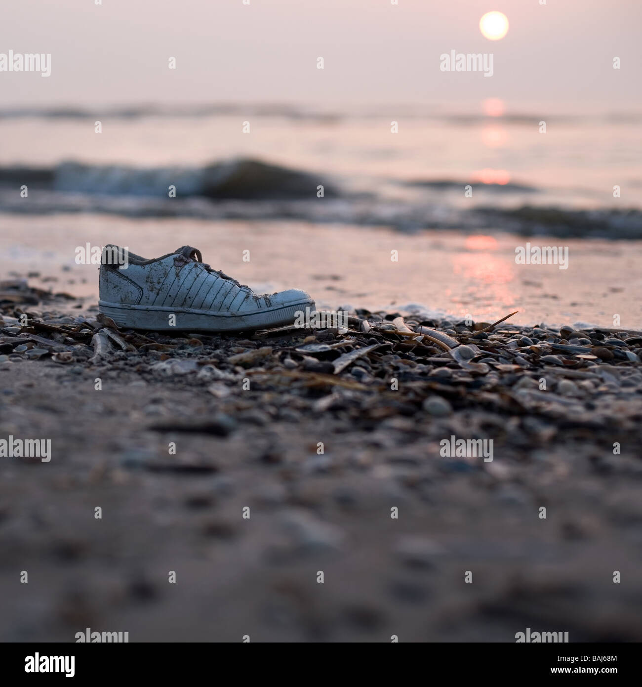 old shoe left on the beach Stock Photo - Alamy