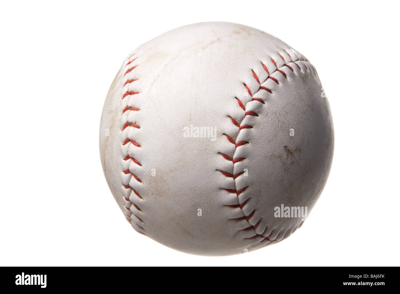 Used white softball isolated on white background. Top left front light ...