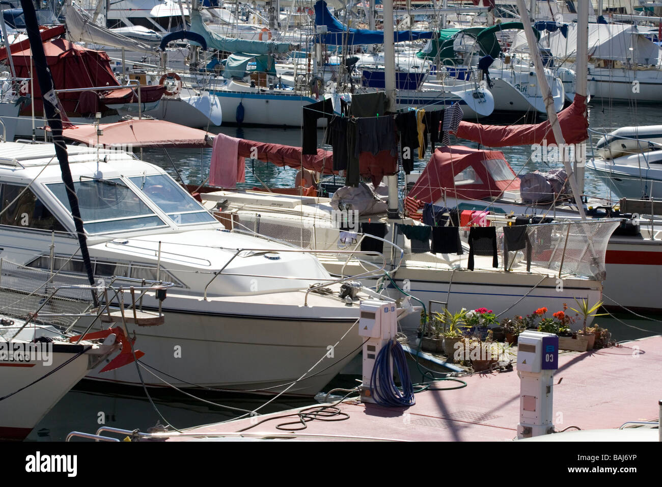 Clothes drying on boats in Marina Stock Photo - Alamy