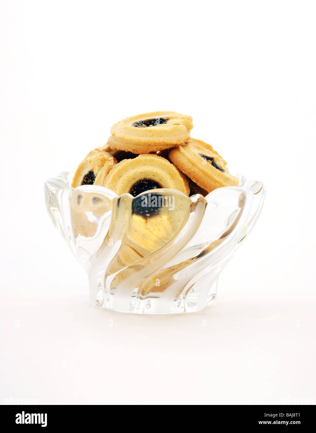 Fruit filled biscuits in a glass dish Stock Photo - Alamy