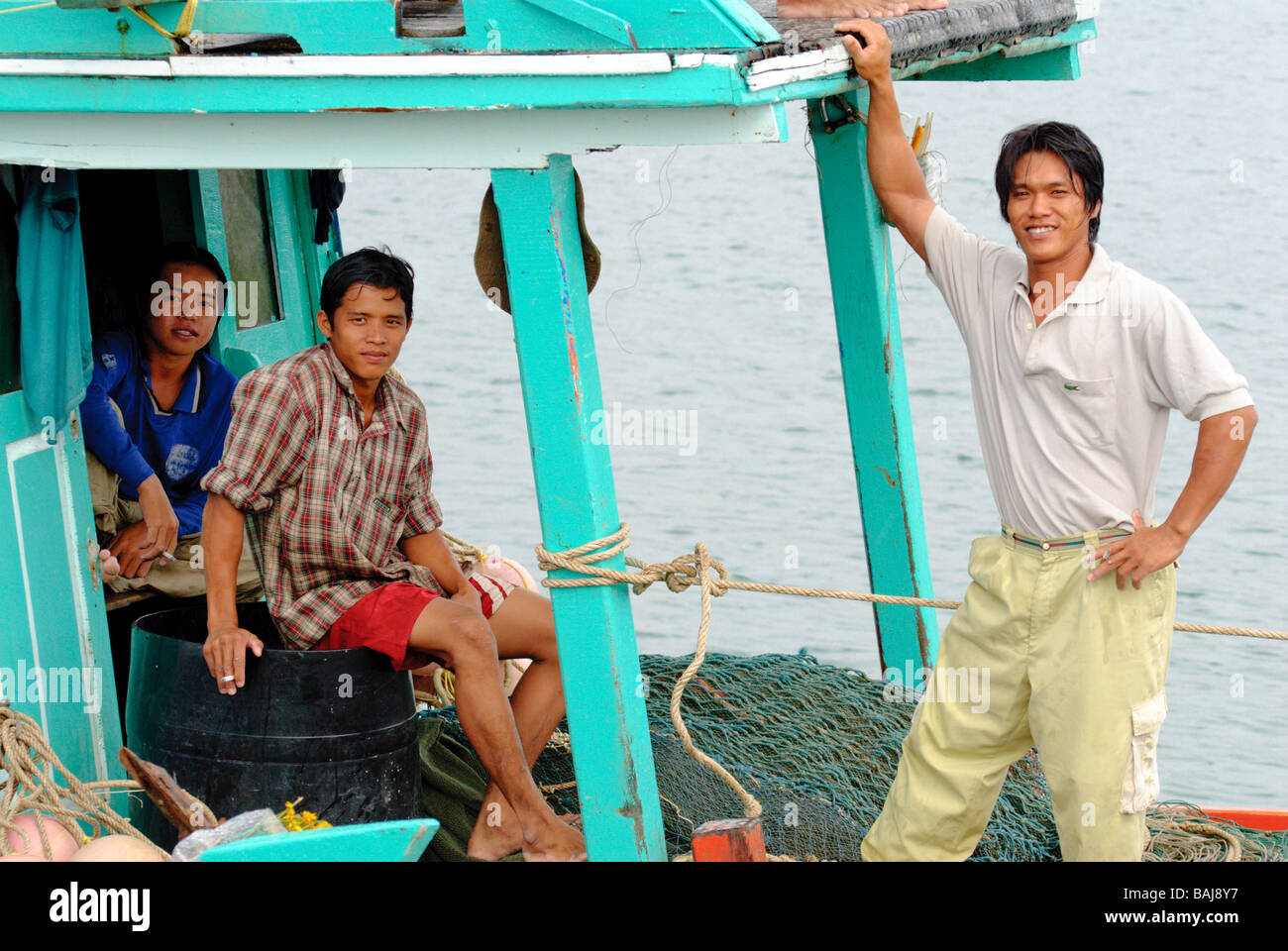 The fishermen on a fishing boat Stock Photo - Alamy