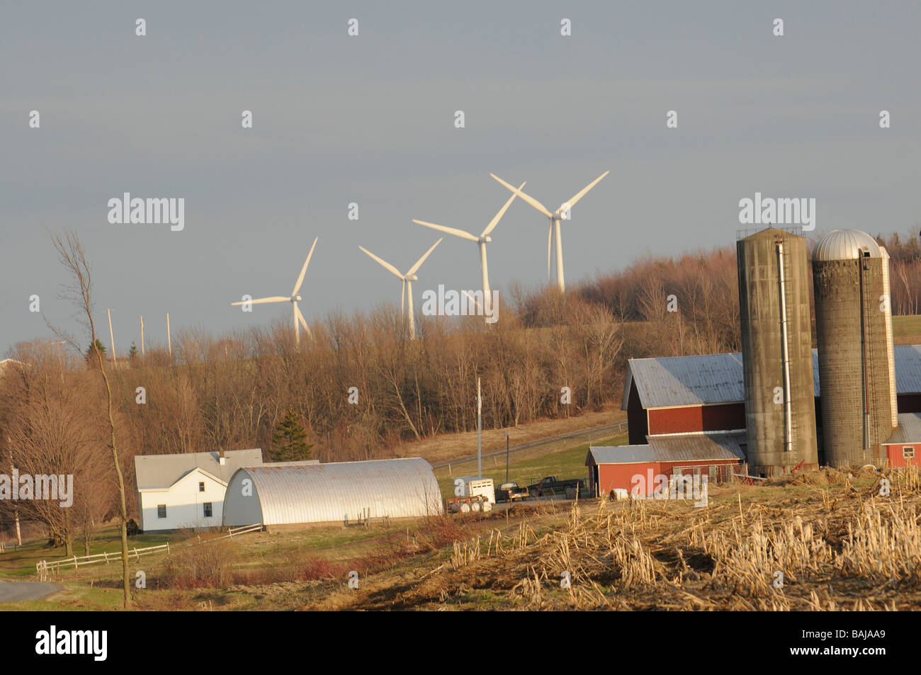 View of wind turbines on farm with barn and silo at Maple Ridge wind ...