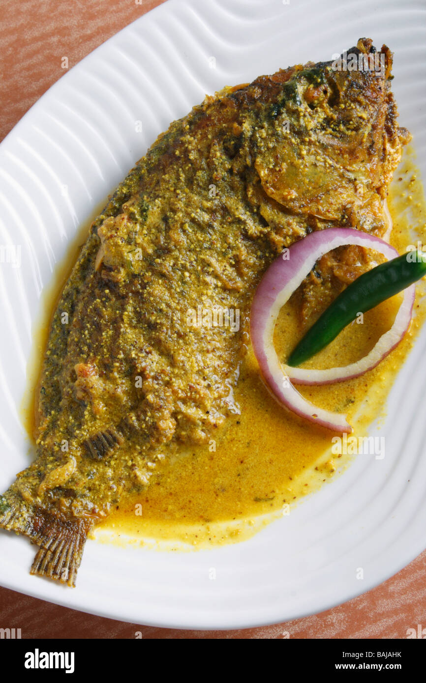 Maacher jhol is a traditional Bengali fish curry Stock Photo - Alamy