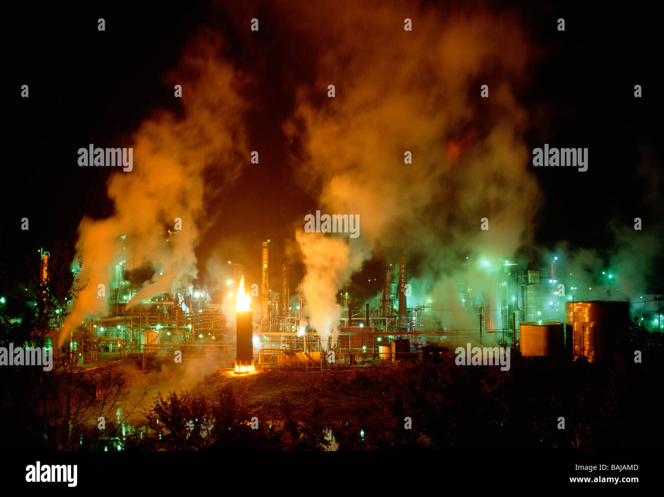 Steam emanating from a refinery in Warren Pennsylvania is reflected in ...
