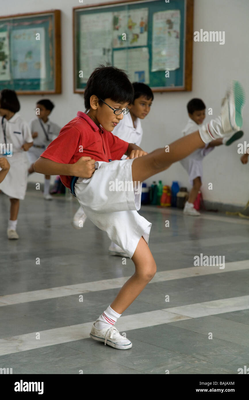 Children in a karate class at school in Hazira, near Surat. Gujarat ...