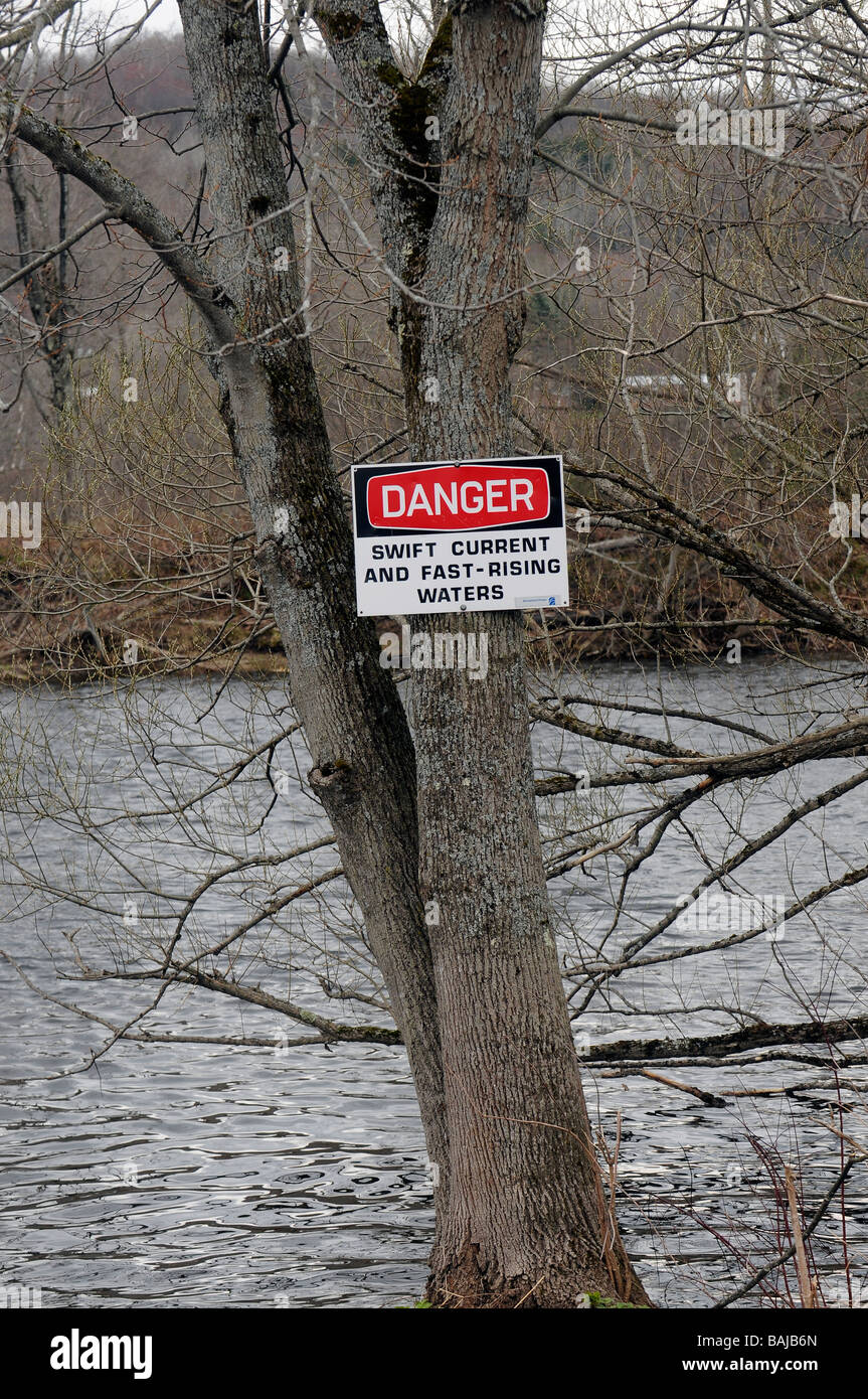 Sign on the West Canada river in Upper State New York in Spring warning ...