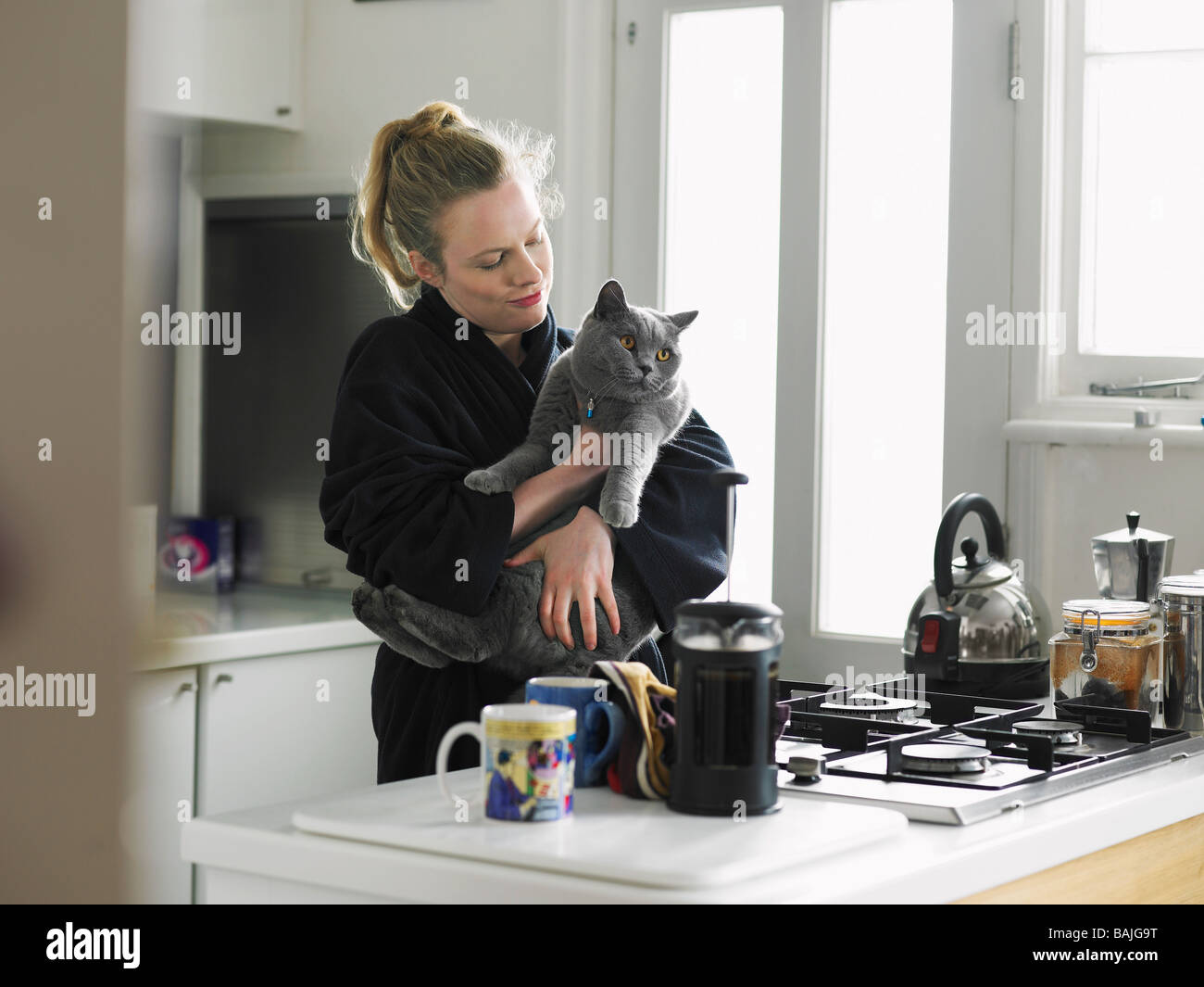 Woman hugging cat blonde hi-res stock photography and images - Alamy