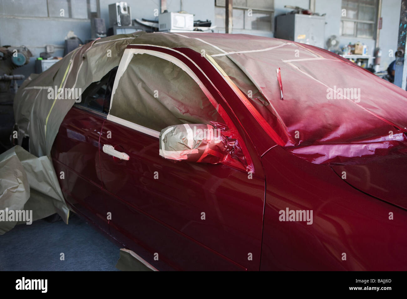 Red painted car in garage Stock Photo - Alamy