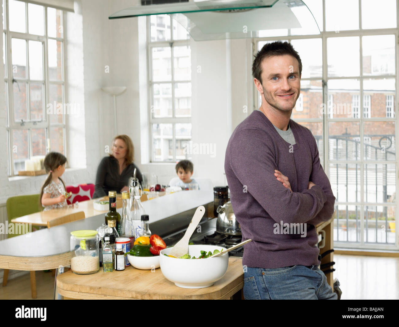 Man standing in kitchen, smiling, (portrait Stock Photo - Alamy