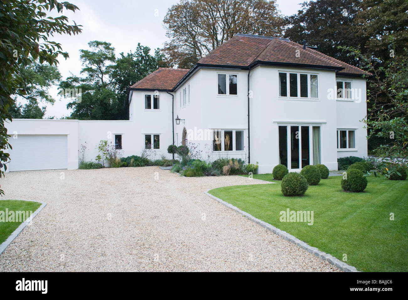 House exterior with surrounding yard and driveway Stock Photo - Alamy