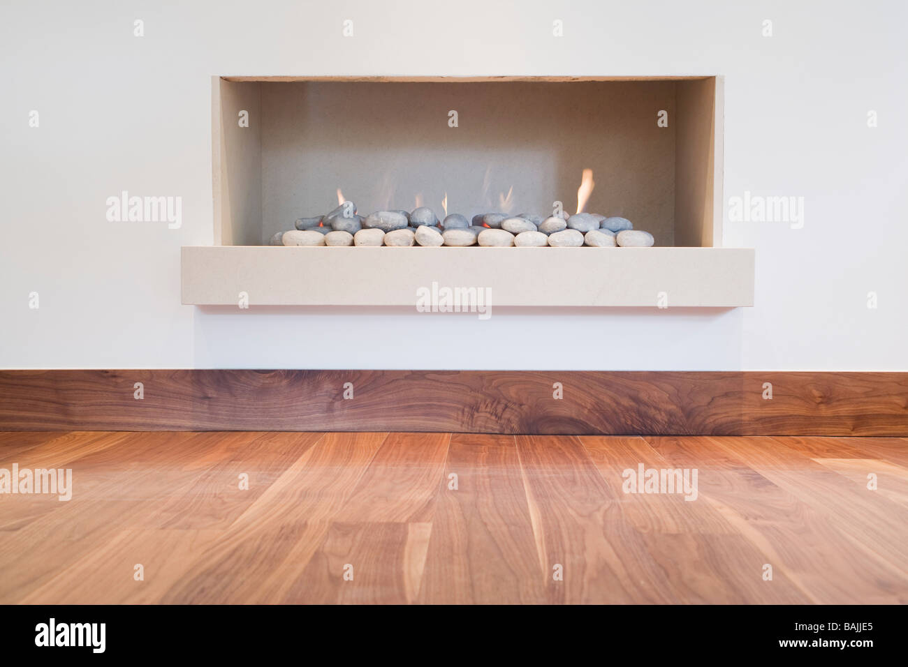 A detail of a modern, simple fireplace Stock Photo - Alamy