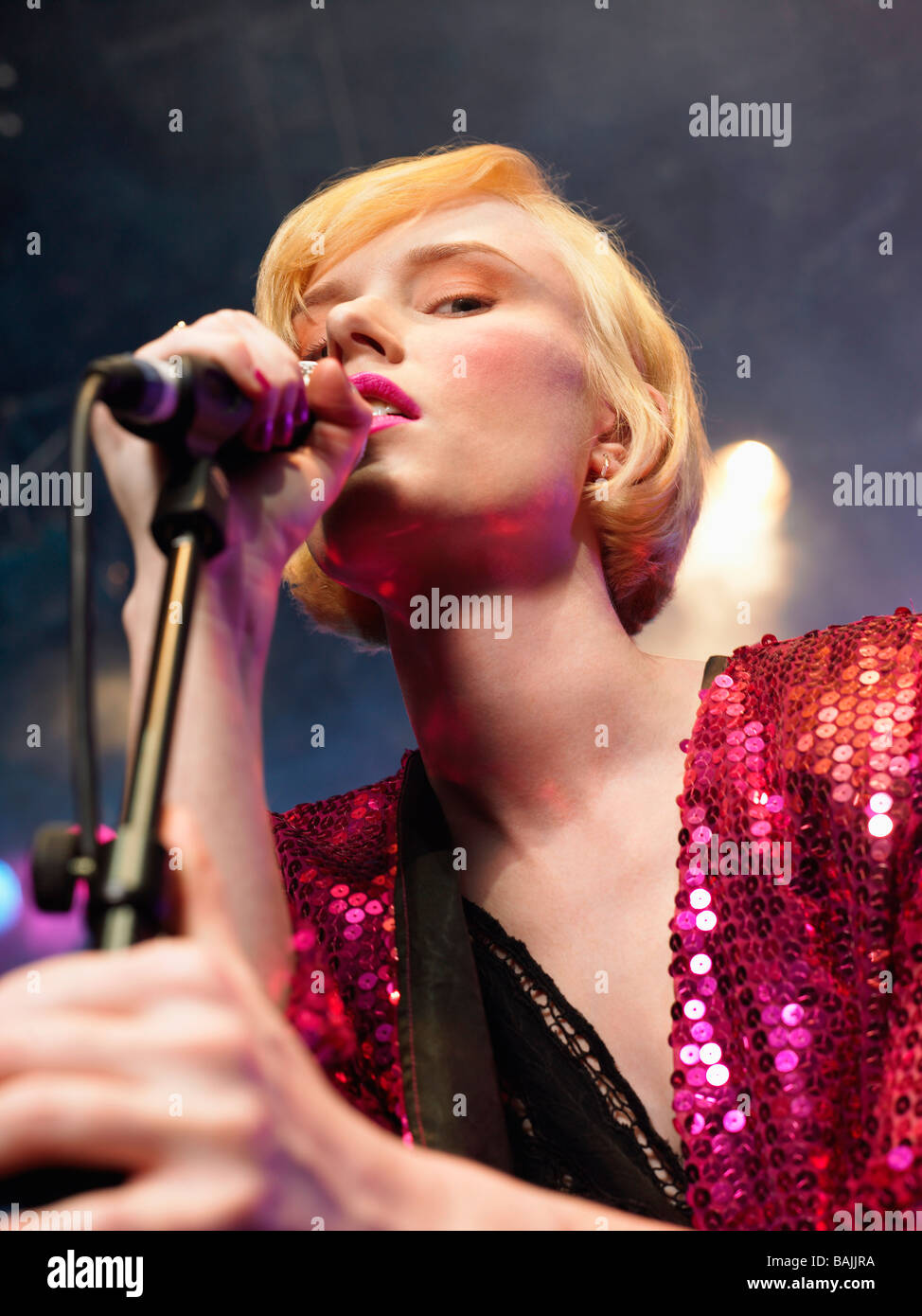 Celebrity performing on stage camera microphone hi-res stock ...