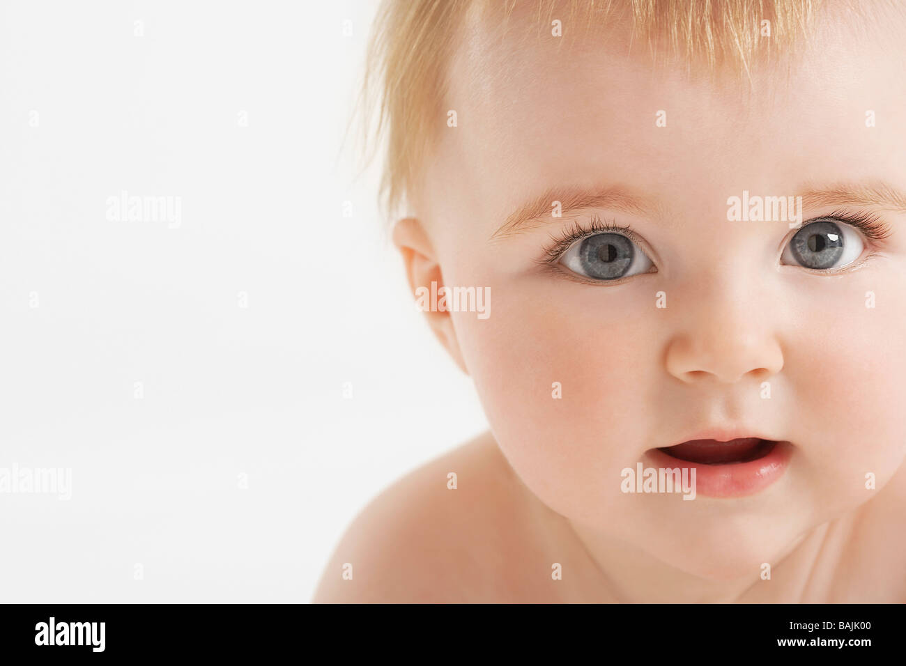 Baby with fuzzy hair and open mouth Stock Photo - Alamy