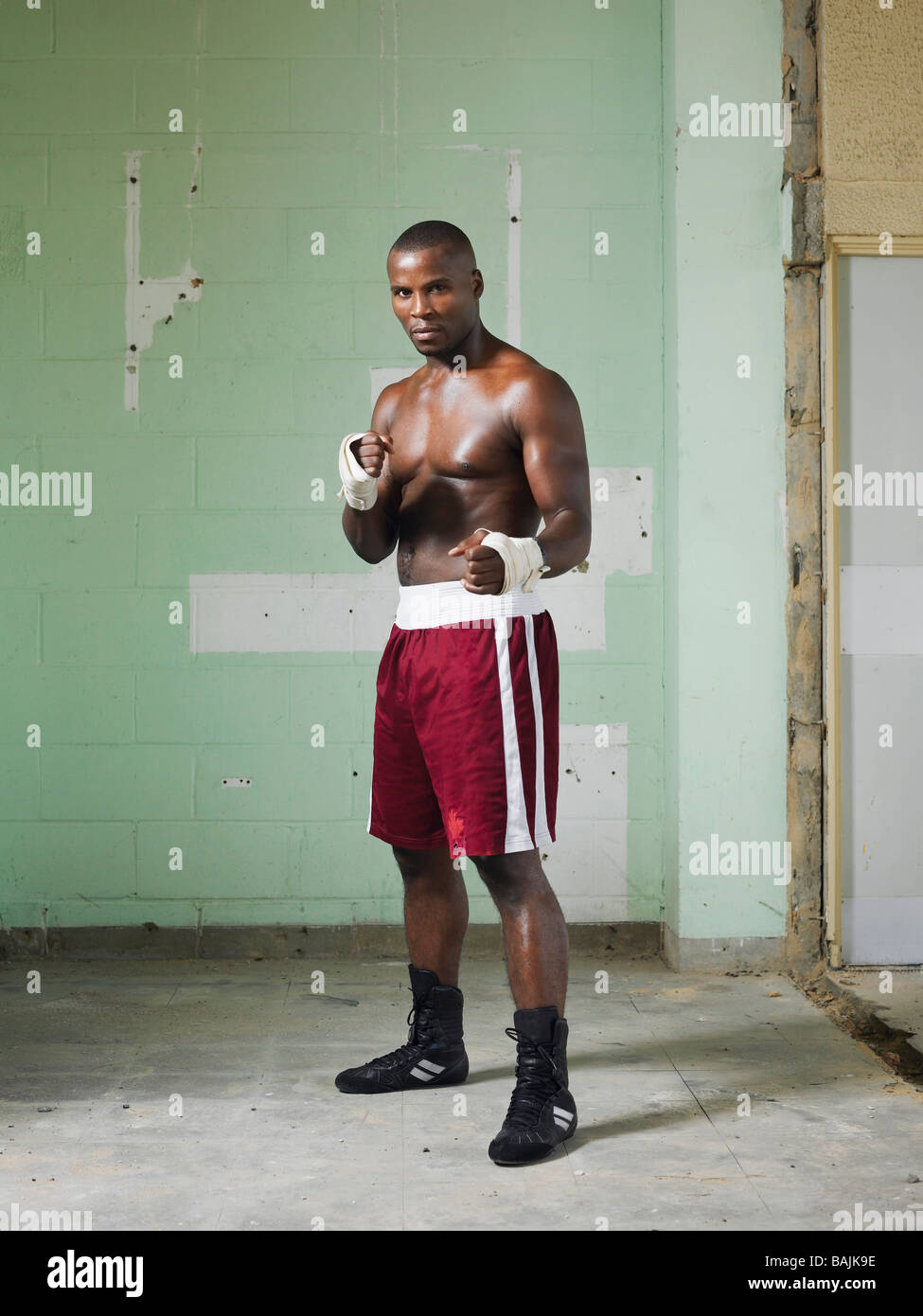 Boxer with raised fists, portrait Stock Photo - Alamy