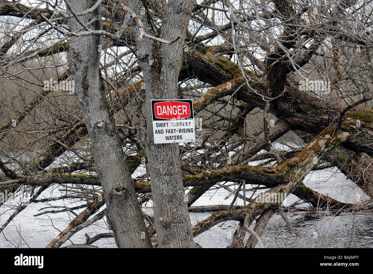 Sign on the West Canada river in Upper State New York in Spring warning ...