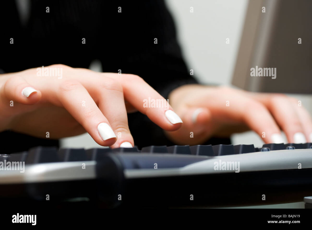 Female hand typing Stock Photo - Alamy