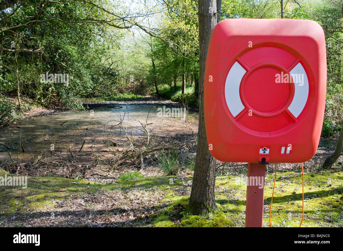 A life ring next to an empty pond Stock Photo - Alamy