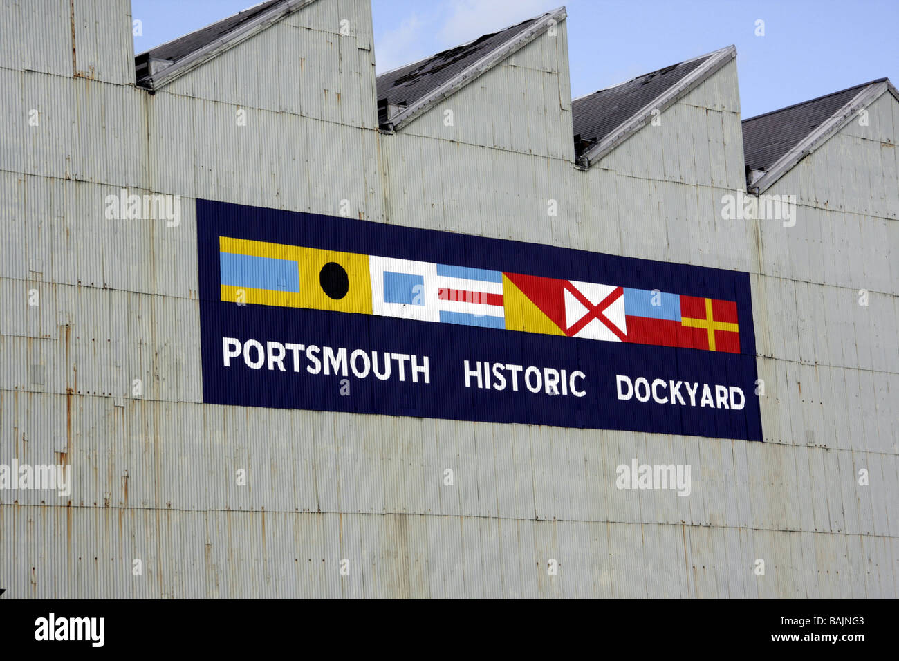 A sign on the wall of a building at Portsmouth Historic Dockyard ...