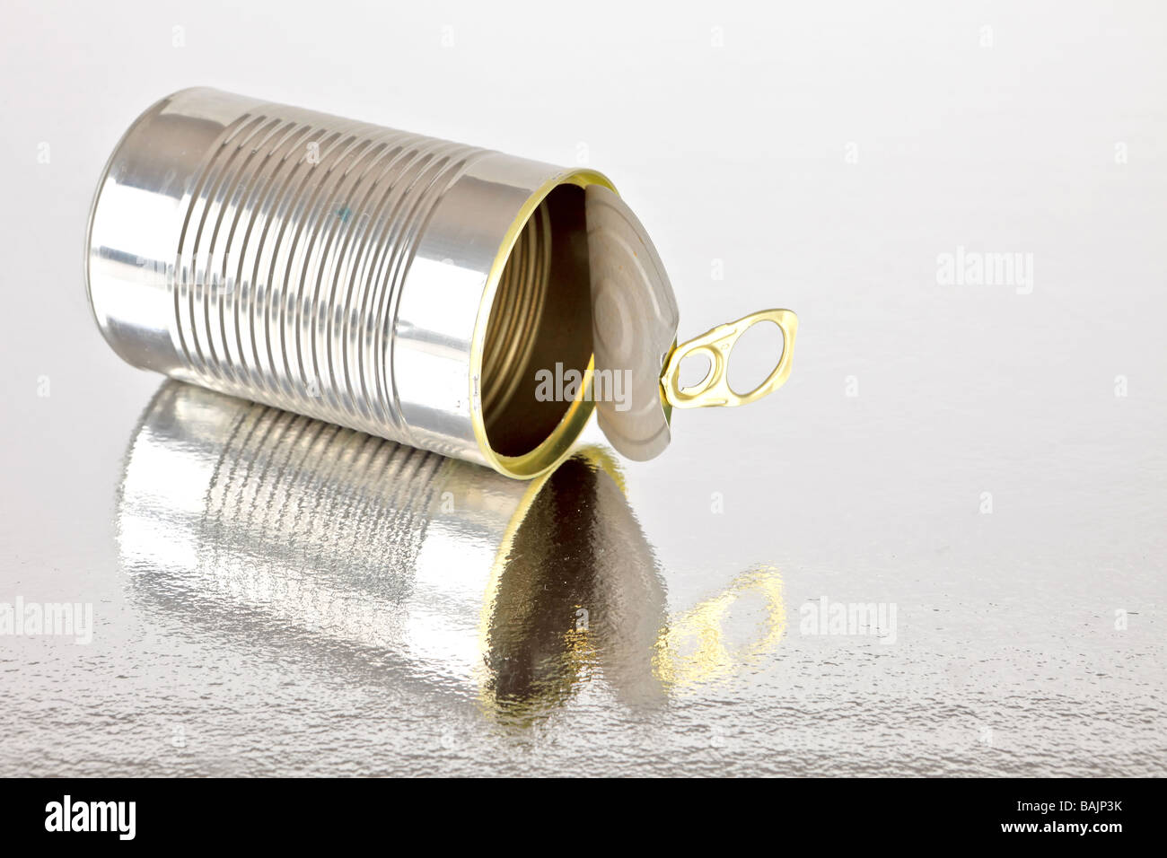 Tin can with ring pull lid and corrugated body opened Stock Photo - Alamy
