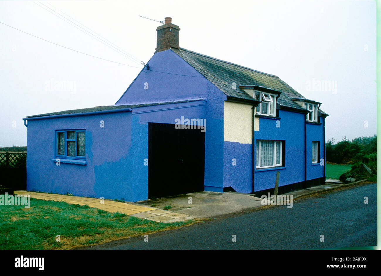 Blue House with the painting not finished Stock Photo - Alamy