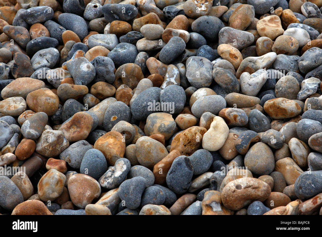 tumbled flint on a beach Stock Photo - Alamy