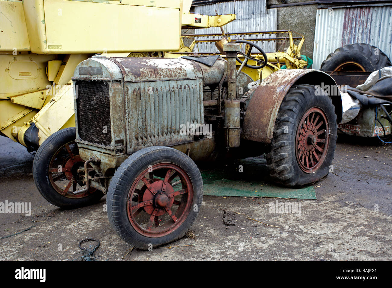 Old rusty tractor in a farmers yard Stock Photo - Alamy