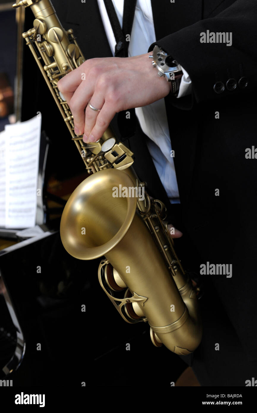 Close-up of alto saxophone being played Stock Photo - Alamy